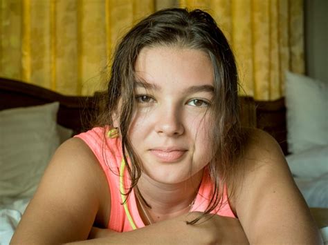 Premium Photo Close Up Portrait Of Girl On Bed At Home