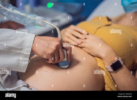 In The Hospital Close Up Shot Of The Doctor Does Ultrasound Sonogram