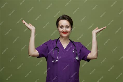 Premium Photo Pleased Middleaged Female Doctor Wearing Uniform And