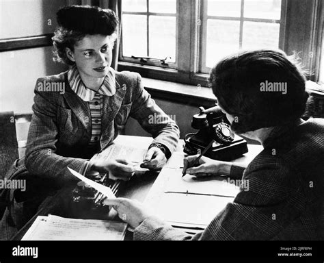 Iris Joyce Talks With A Recruiting Officer As She Enrols In The Womens Land Army During 1942