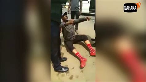 Nigerian Senator Dino Melaye Sits On The Ground Tries To Resist Arrest