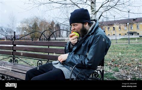 Below Poverty Line Caucasian Beggar Is In A City Park Consequences Of Drunkenness Alcoholism