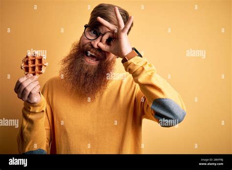 Redhead Irish Man With Beard Eating Sweet Belgian Waffle Pastry Over