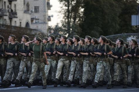 Female Soldiers Of A Womens Battalion Marching On A Square With Machine Guns Military Parade
