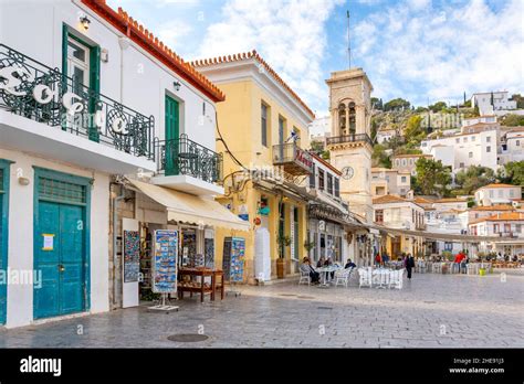 Colorful Shops And Cafes Line The Waterfront Promenade At The Greek