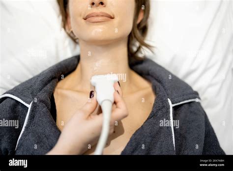 Doctor Examining Thyroid Of Female Patient With Ultrasound Scan In Clinic Stock Photo Alamy