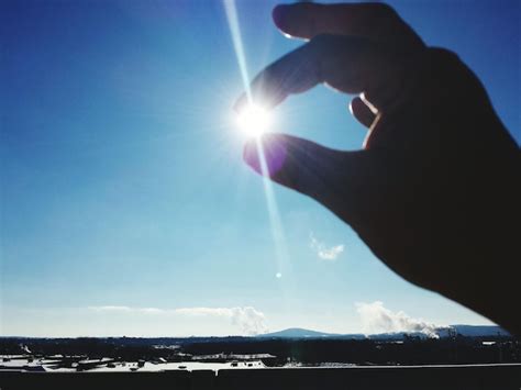 Premium Photo Optical Illusion Of Person Holding Sun