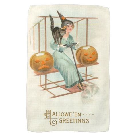 An Old Fashioned Halloween Postcard With A Woman And Cat