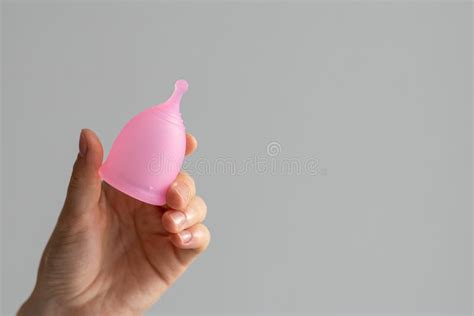 A Pink Reusable Menstrual Cup In A Woman S Hand Women S Health Concept