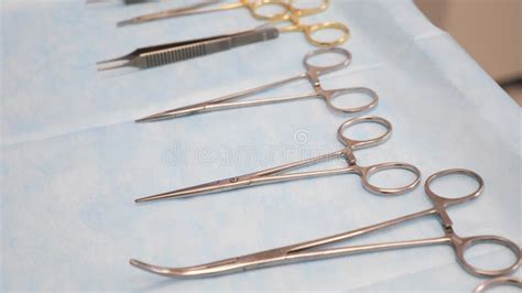 Clamps And Surgical Instruments Prepare For Surgery In Operating Room