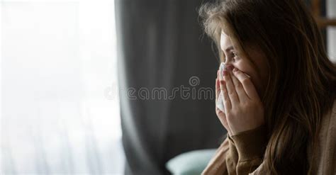 Sick Day At Home Woman With Runny Nose And Common Cold She Sneezes