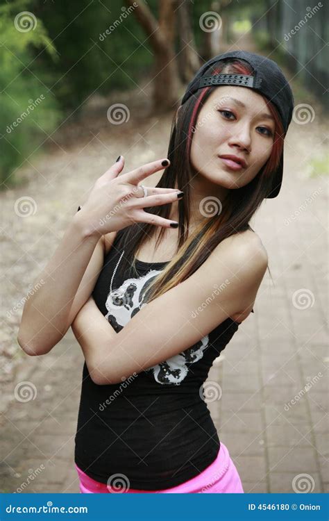 Cool Asian Girl Looking At Viewer Stock Photo Image Of Daytime