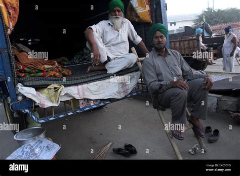 Farmers Sit In Their Tractor Trollies On A Blocked Highway As They