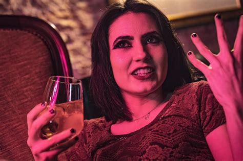 Premium Photo Seductive Rebel Brunette Girl Holding A Drink With A