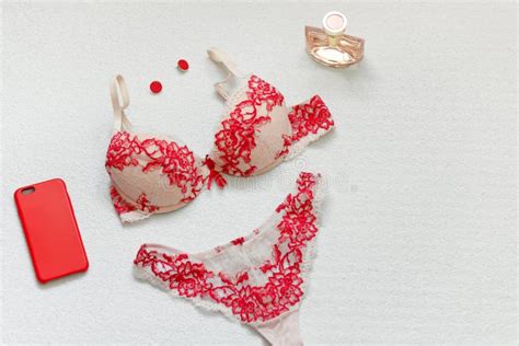 Women`s Erotic Underwear And Red Roses On White Surface Red Lacy