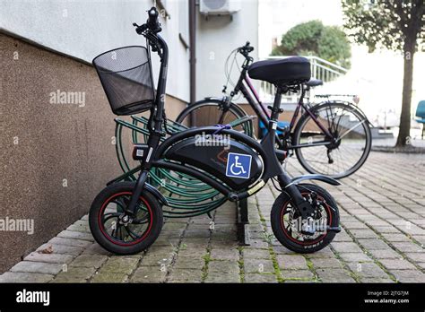 Disabled Electric Scooter With Handicap Icon On The Side City Stock