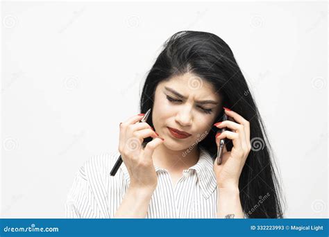 A Woman Is Talking On Her Cell Phone While Wearing A Black Suit Stock