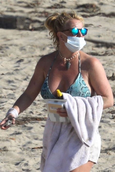 Britney Spears Sunbathing On The Beach In Malibu With Her Security