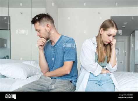 Unhappy Couple In Argument With Disappointed Woman And Sad Man Sitting