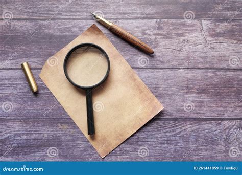 Open Book And Magnifying Glass On Table Stock Image Image Of