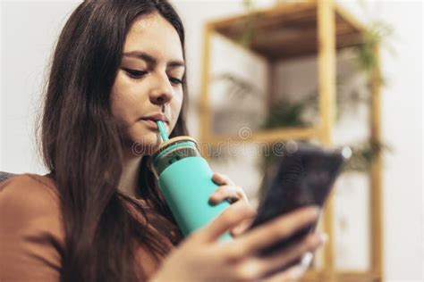 Teenager Girl Surfing Social Media On Smart Phone While Having Leisure