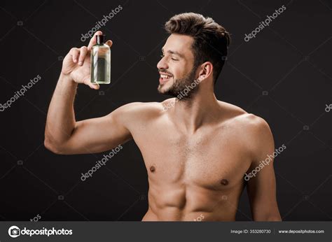 Sexy Smiling Naked Man Holding Bottle Cologne Isolated Black — Stock