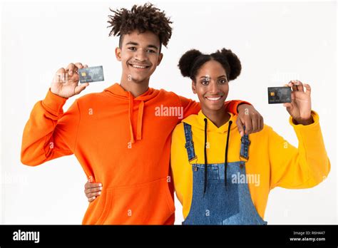 Photo Of Smiling African American Couple Standing Together And Holding