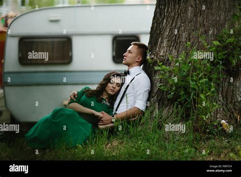Man And Woman Under A Tree Stock Photo Alamy
