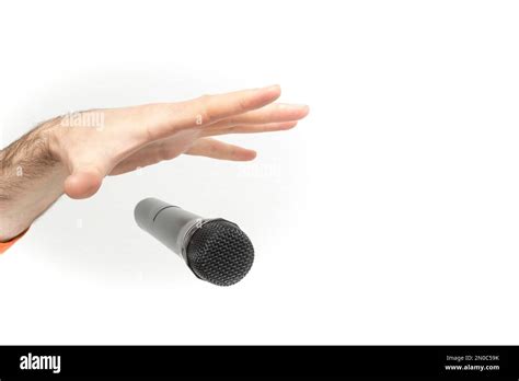 Caucasian Males Hand Dropping The Mic Stretched Hand And A Microphone