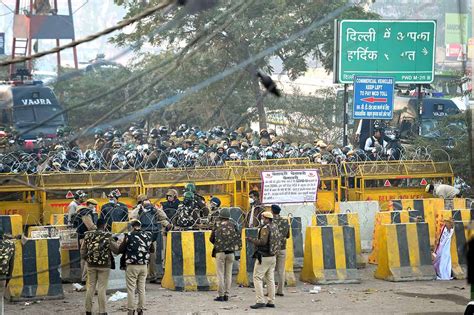 Farmers Reach Near Delhi Borders Defying Barricades Tear Gas Rediff