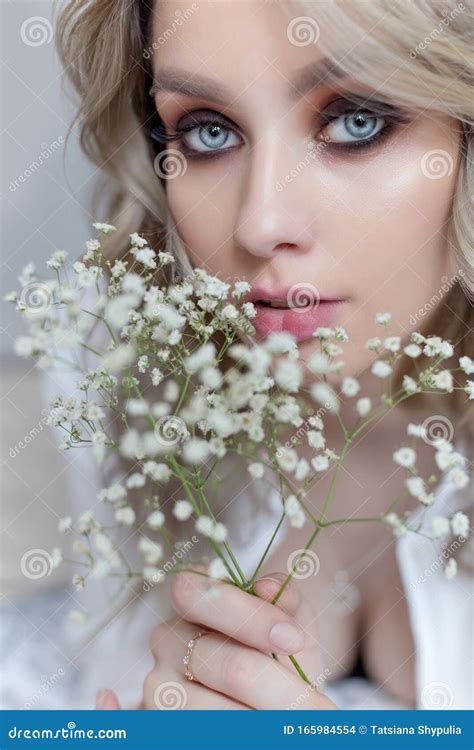 Beautiful Sweet Girl With A Large Bouquet Of Flowers For The Holiday