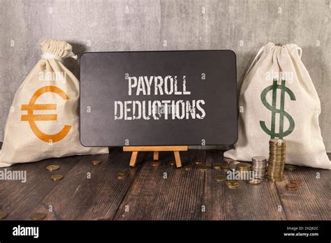 Selective Focus Calculator Pencil And Banknotes With The Word Payroll Deduction On World Map