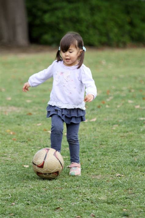 Japanese Girl Playing With Soccer Ball Stock Image Image Of Green