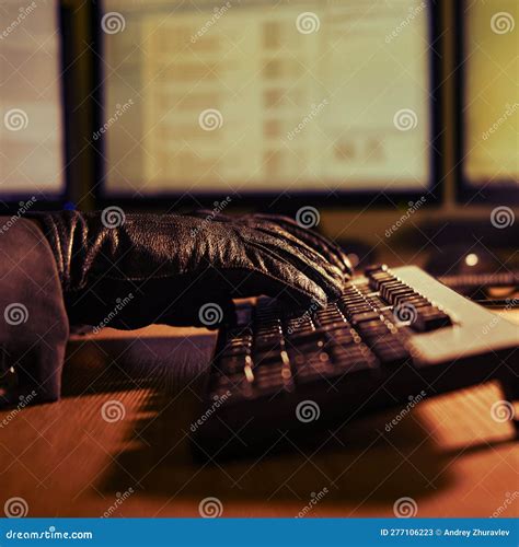 Man Attacker Hacker In Black Gloves On His Hands Working On A Compu