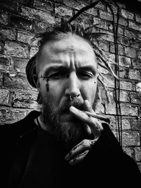 Premium Photo Portrait Of Man Smoking Cigarette