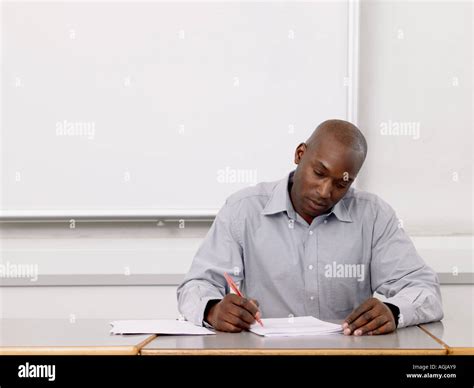 Teacher Marking Paperwork Hi Res Stock Photography And Images Alamy