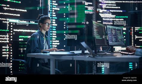 Portrait Of A Woman Working On A Computer Typing Lines Of Code That