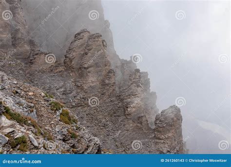 Rock Formations On Mystical Foggy Hiking Trail Leading To Mount Olympus
