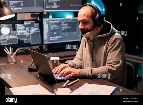Web Developer With Medical Neck Brace Working On Coding Using Source