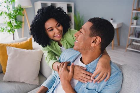 Photo Of Nice Young Man Girl Sit Sofa Cuddle Support Each Other Modern