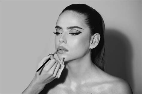 Premium Photo Makeup Artist Applies Red Lipstick Hand Of Make Up
