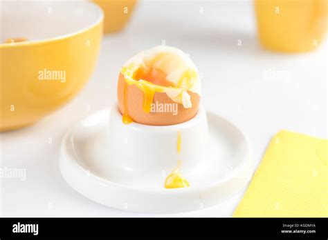 Close Up Of Soft Boiled Egg With Cracked Eggshell For Breakfast Next To