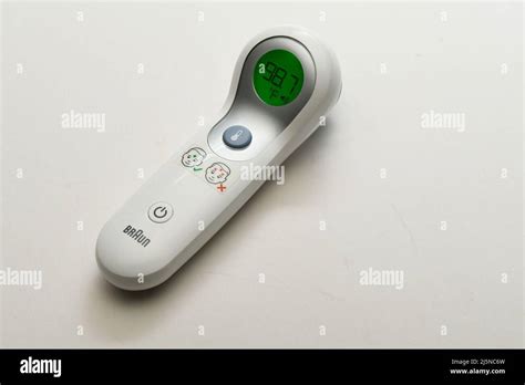 Cut Out Touchless Non Contact Digital Thermometer Showing Normal Body Temperature Commonly Used