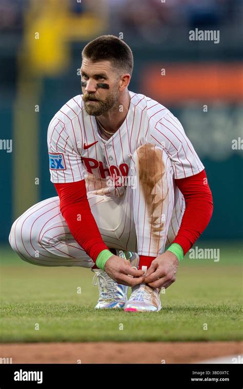 Philadelphia Phillies Bryce Harper Looks On As He Ties His Cleats