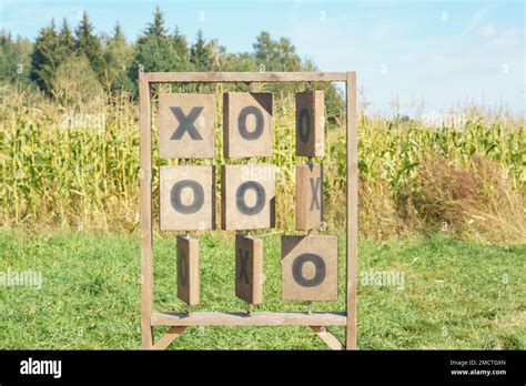 huge vertical stand of wooden tic tac toe noughts and crosses game