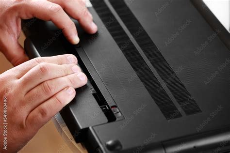 Repairman S Hands Removing The Power Battery From The Laptop Computer Service And Repair