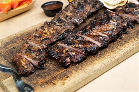 Fried Spare Ribs Pork Ribs Barbecue Grill On Wooden Cutting Board