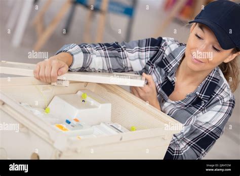 A Woman Is Opening And Fixing A Printer Stock Photo Alamy