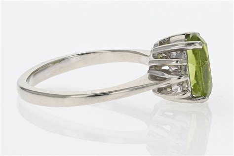 135ctw Oval Peridot And Diamond Accents Statement Ring 14k White Gold