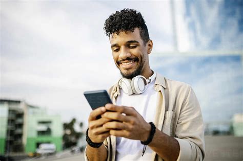 Happy Man With Headphones Using Smart Phone Stock Photo Blank Template